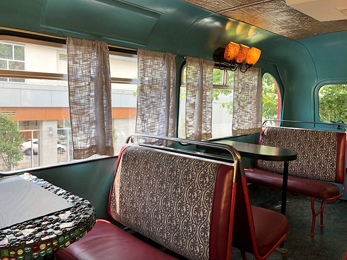 Up top, it's a cozy nook that's part London pub, part Asheville chic. The perfect spot for plotting your next adventure... or just people-watching.