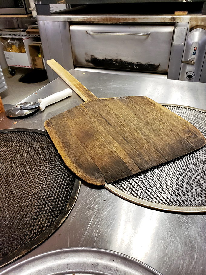 Where the magic happens! Rosa's kitchen might not be fancy, but it's got all the right ingredients for pizza perfection &ndash; including that well-seasoned pizza peel.