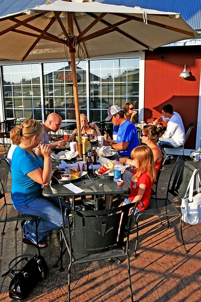 Al fresco feasting at its finest! Nothing says summer like enjoying mouthwatering barbecue under the Iowa sky. It's like a picnic, but with way better food.