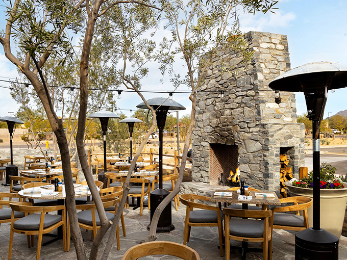 Al fresco perfection! This outdoor seating area, complete with a cozy fireplace, is where desert nights meet oceanic delights in perfect harmony.