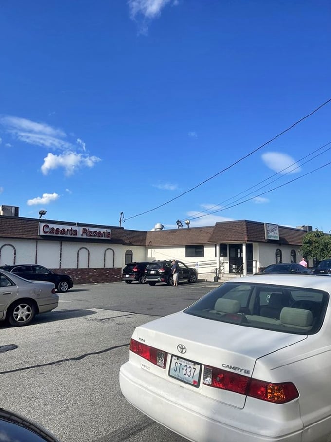 Pizza pilgrims, your journey ends here! Caserta's parking lot is where the magic begins, as the aroma of baking pies draws you in like a cheesy tractor beam.