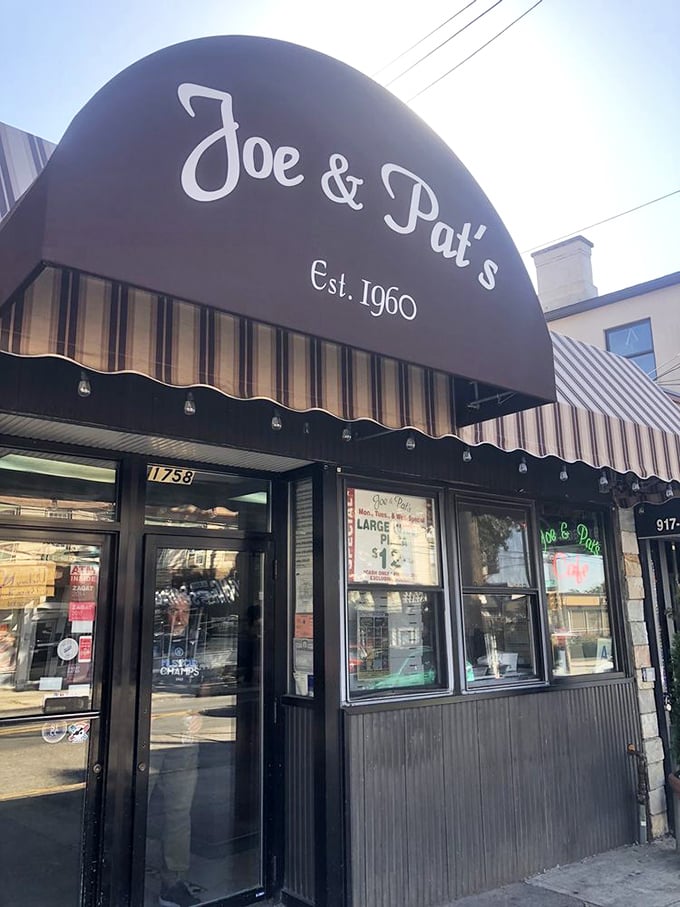 The gateway to gastronomic bliss! Joe & Pat's facade is like a beacon of hope for hungry souls seeking pizza salvation.