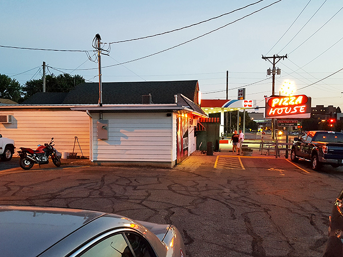 As the sun sets, Charlie's Pizza House glows like a beacon of hope for empty stomachs. Pizza night has never looked so inviting!
