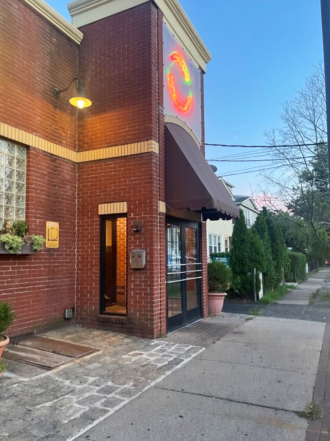 The pizza promised land! This unassuming exterior hides a world of cheesy wonders waiting to be discovered.