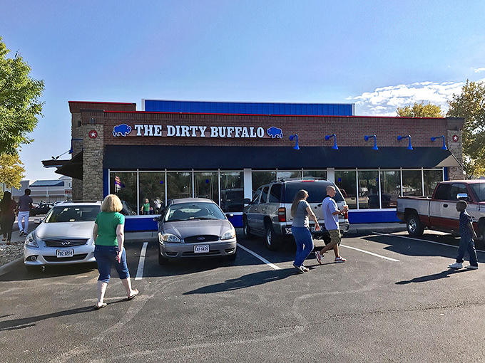The parking lot filled with cars of wing pilgrims making their journey to flavor town. Some restaurants attract customers; The Dirty Buffalo creates disciples.