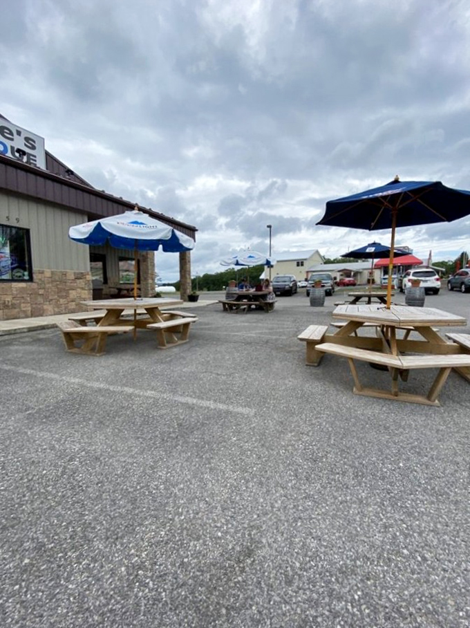 The outdoor seating area&mdash;where fresh air enhances the barbecue experience. Those picnic tables have supported more happy elbows than an orthopedist.