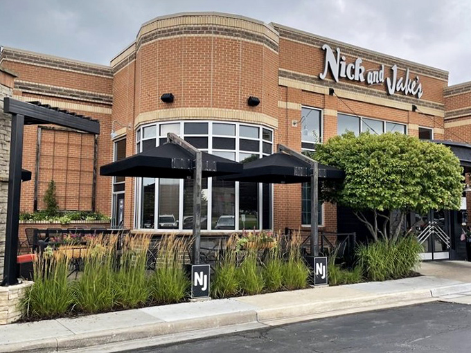 The landscaped exterior says "respectable dining establishment," but inside is where the real magic happens.