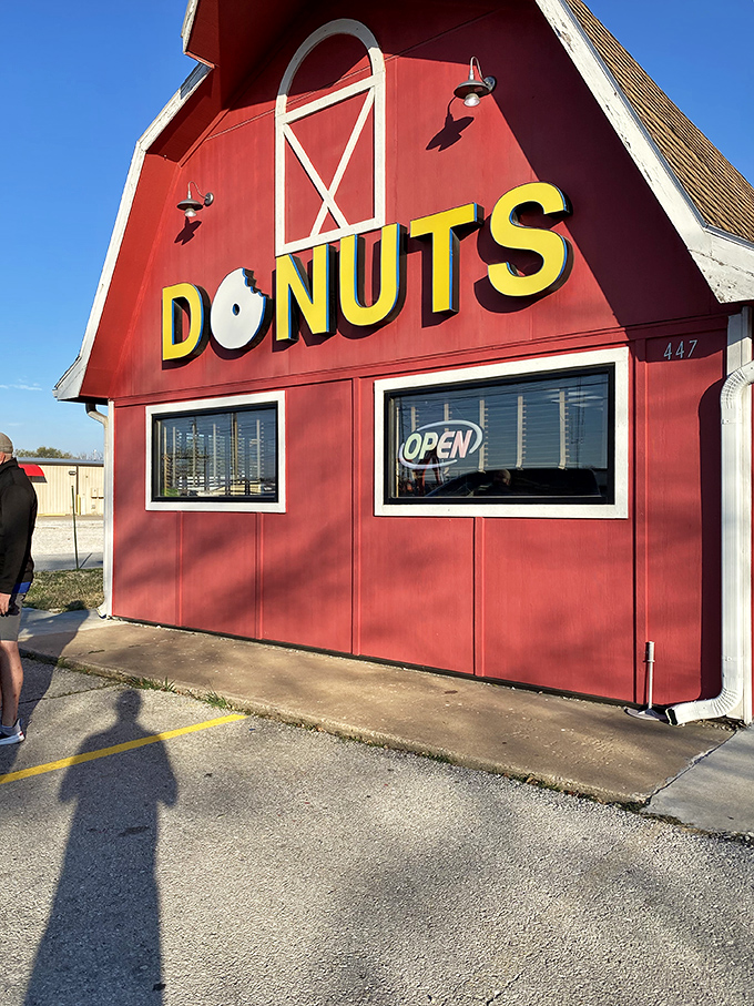 The red barn exterior isn't just architecture&mdash;it's a promise that inside these walls, donut dreams come true for everyone who enters.