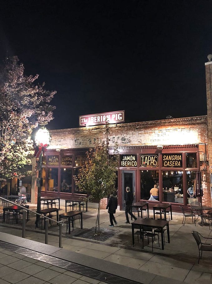 As evening falls, The Iberian Pig transforms into a beacon of warmth for food pilgrims seeking porcine perfection in Decatur.