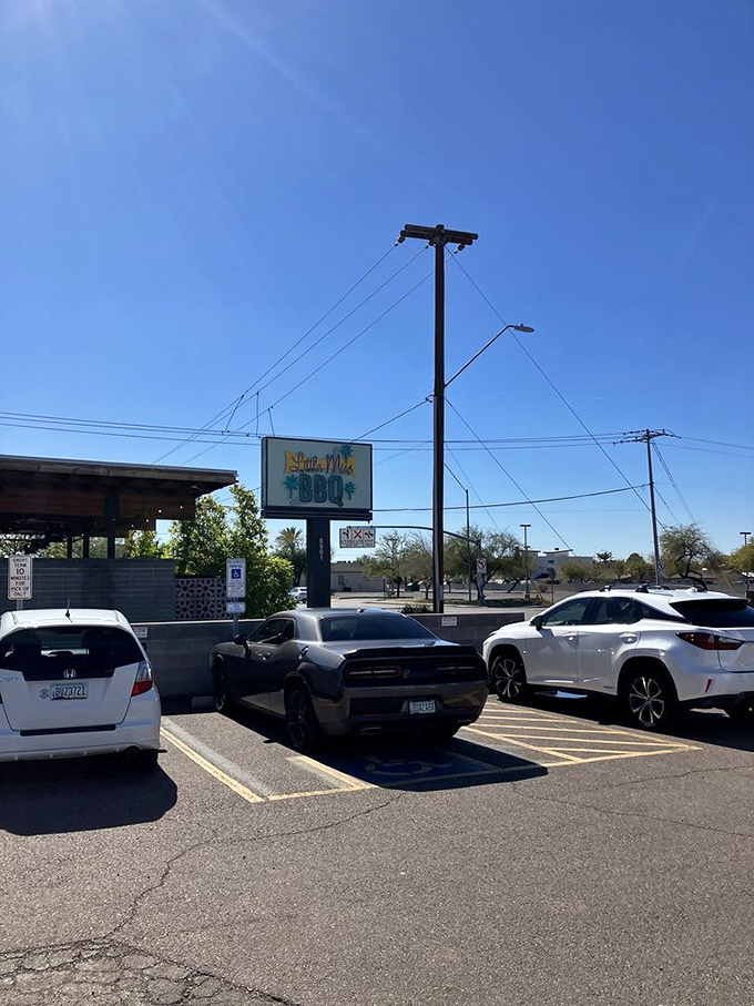 X marks the spot! This sign is like a beacon of hope for hungry travelers, promising smoky treasures within.