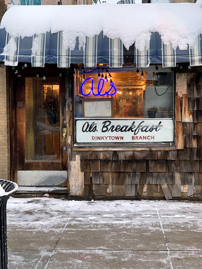 Snow-capped awning, neon glow &ndash; Al's isn't just open for breakfast, it's a beacon of hope on a frosty Minnesota morning.