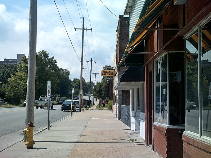 Small-town charm, big-time flavor! Olsen Bake Shop stands as a sweet beacon on this quiet street, drawing in donut lovers like moths to a delicious flame.