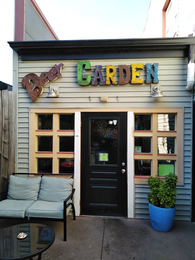 The Beer Garden: Where hops grow and worries shrink. It's like a magic portal to relaxation, disguised as a charming entrance.