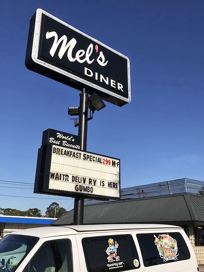 The beacon of breakfast hope! Mel's sign promises biscuit bliss and gumbo goodness to all who enter.