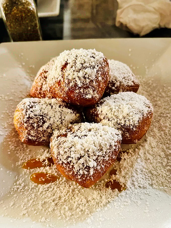 Powdered sugar snowfall on pillowy beignet mountains – it's dessert nirvana! These little French doughnuts are proof that sometimes, the best things in life are deep-fried.
