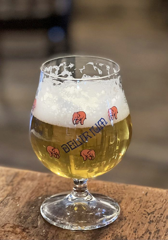 Cheers to good taste! This frothy brew, served in a playful glass, is the perfect partner for your pub grub adventure.