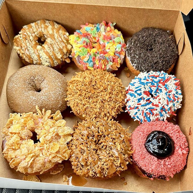 Donut nirvana achieved! This box of assorted bliss is your ticket to a sugar-coated adventure. Choose wisely (or don't &ndash; they're all winners)!