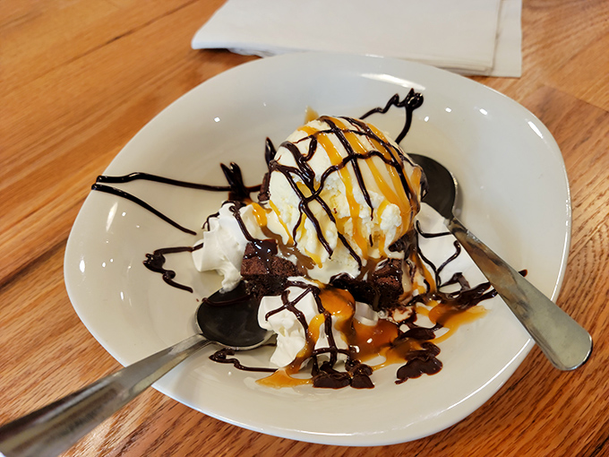 A brownie sundae that understands the perfect ratio of warm to cold, chocolate to vanilla, and indulgence to "I regret nothing."