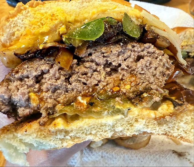 Behold, the anatomy of perfection. This cross-section reveals the juicy secrets that make Nic's burgers legendary. Prepare to drool!