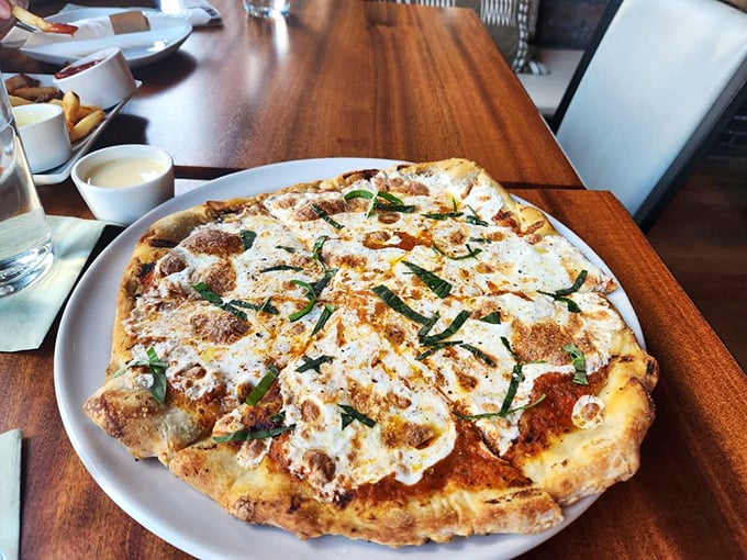 Pizza perfection with a blistered crust and fresh basil that makes every other delivery pie seem like a sad compromise. Worth every mile driven.