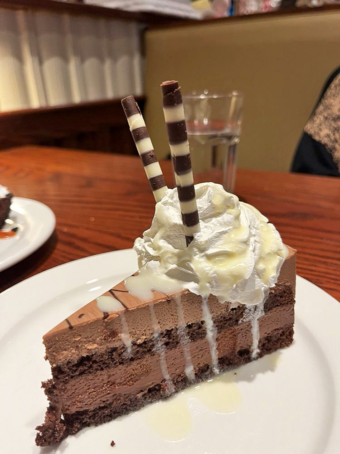 A chocolate mousse cake that's dressed to the nines. Fancy straws included for your inner child.