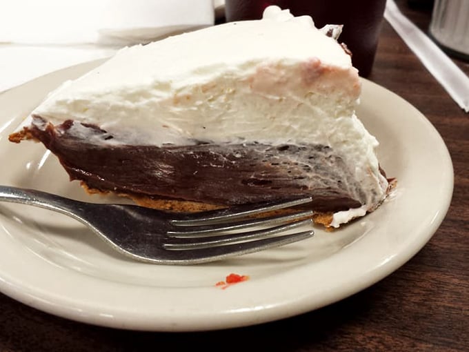 Chocolate pie with a cloud of whipped cream so substantial it needs its own zip code. Worth every minute on the treadmill you'll promise yourself later.