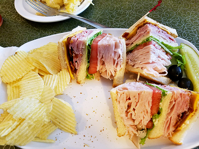The club sandwich at Charlotte's is stacked higher than my unread books at home. Each layer is a different chapter in the story of lunch perfection.