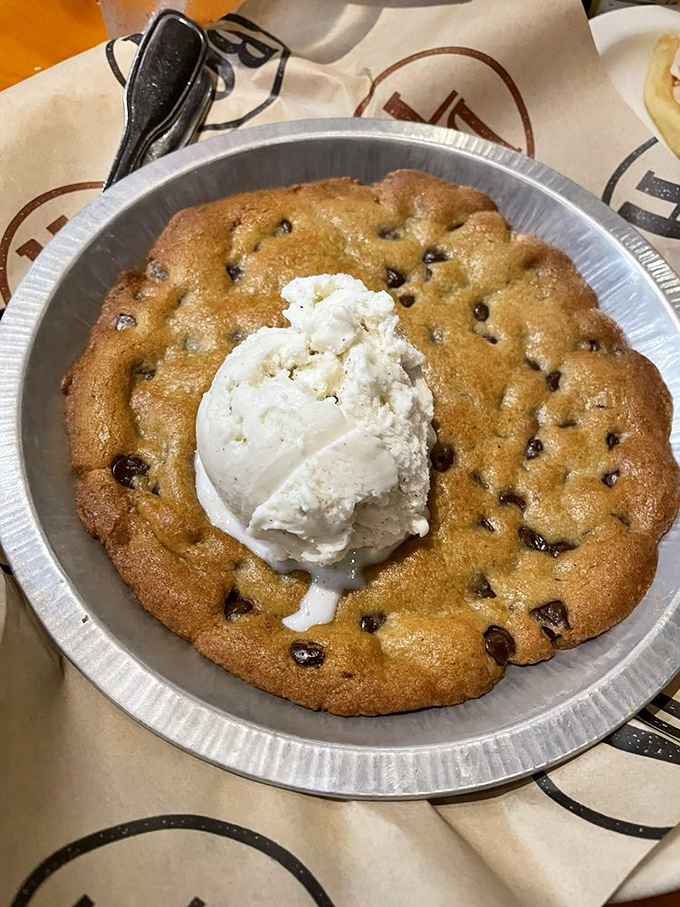 The chocolate chip cookie that arrives still warm from the oven, topped with ice cream melting into those chocolate rivers of childhood nostalgia.