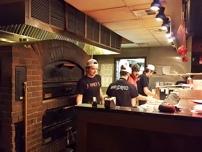 Masters of the pizza universe! The crew works their magic, turning dough and cheese into edible works of art.