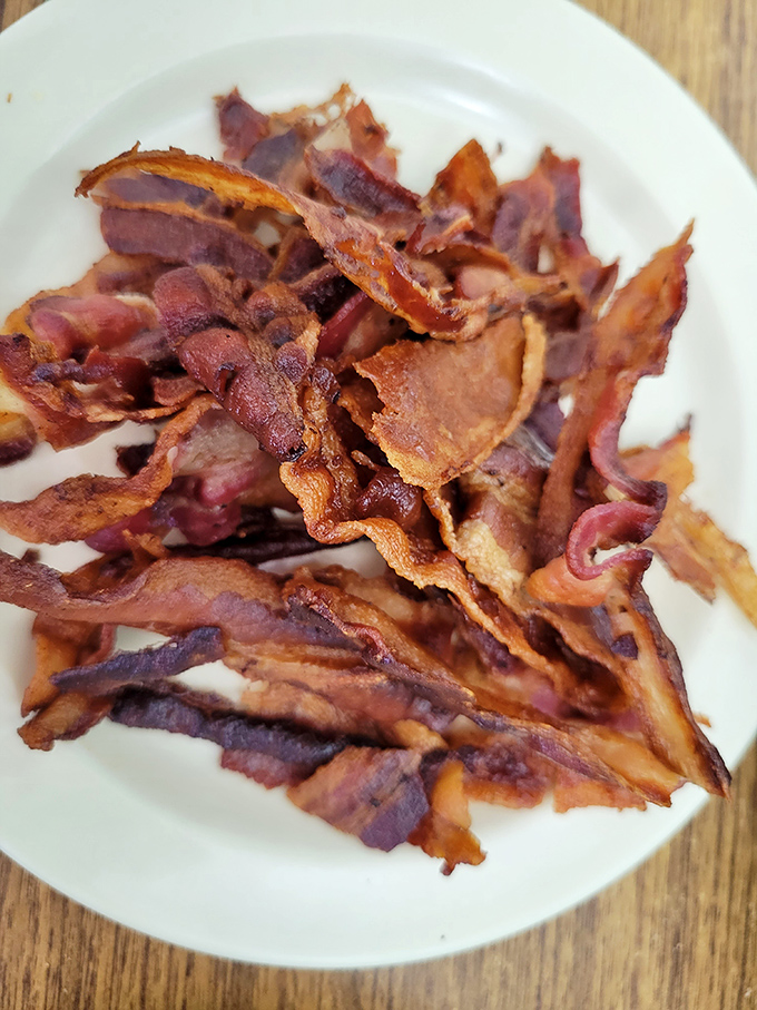 Bacon so crispy, it practically shatters on impact. A symphony of salty, smoky goodness that'll make your morning sing.