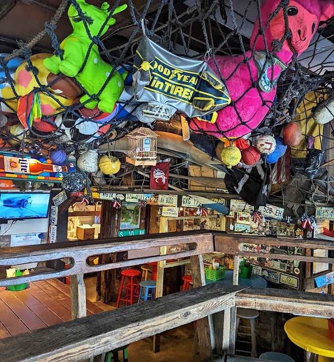 Look up and laugh! Le Tub's ceiling decor is a whimsical wonderland where inflatable animals party with vintage signs.