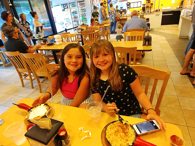 Smiles all around! These happy diners prove that good mac and cheese is the ultimate mood lifter.