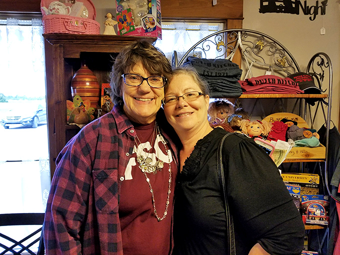 Smile! Patrons enjoying the restaurant's warm atmosphere, surrounded by charming country decor and merchandise.