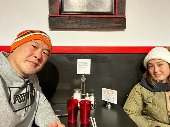 Happy diners enjoying their meal, proving that at No Frills, the only thing better than the food is the company you share it with.