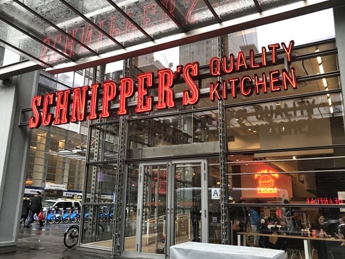 That glowing Schnipper's sign cuts through a rainy New York day like a beacon of hope. Inside awaits warmth, both literal and culinary.