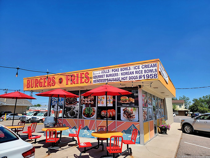 Big Sky Burger: where burgers meet big flavors. This exterior shot showcases the restaurant's diverse menu and inviting atmosphere.