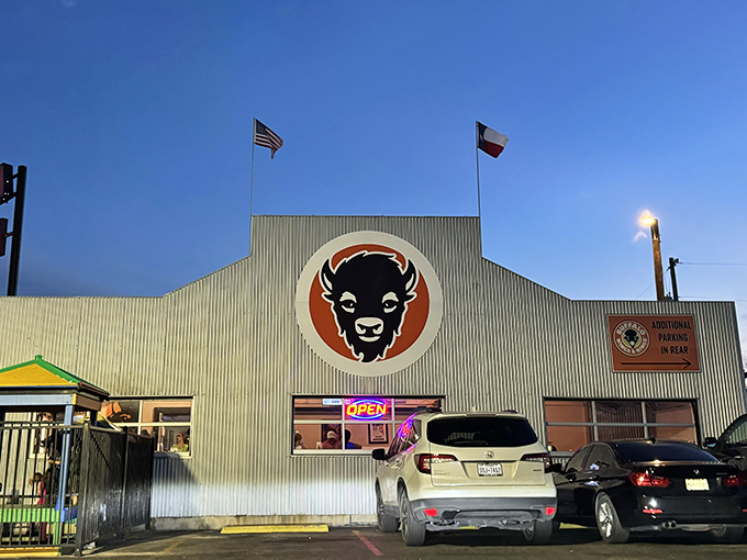As evening falls, the illuminated buffalo logo serves as a North Star for the hungry and wing-deprived across New Braunfels.