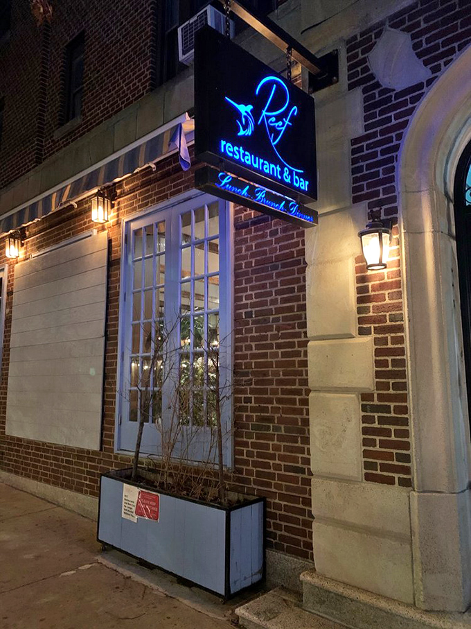 Reef's neon sign: a beacon of hope for hungry sailors navigating the urban seas of Forest Hills. Abandon ship and come ashore!