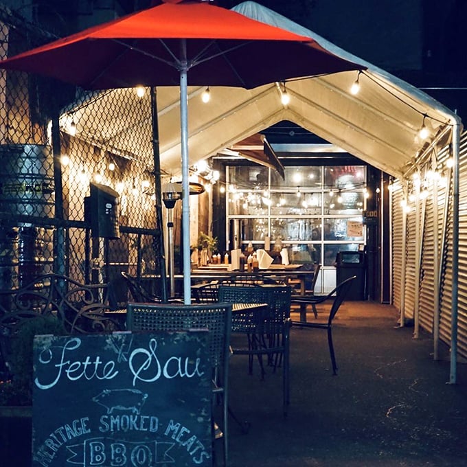 As night falls, Fette Sau's outdoor space transforms into an urban oasis. String lights and smoked meats&mdash;a match made in heaven.