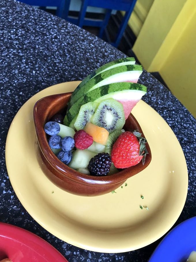 A rainbow you can eat! This fruit bowl is nature's candy, artfully arranged and ready to add a burst of freshness to your morning feast.
