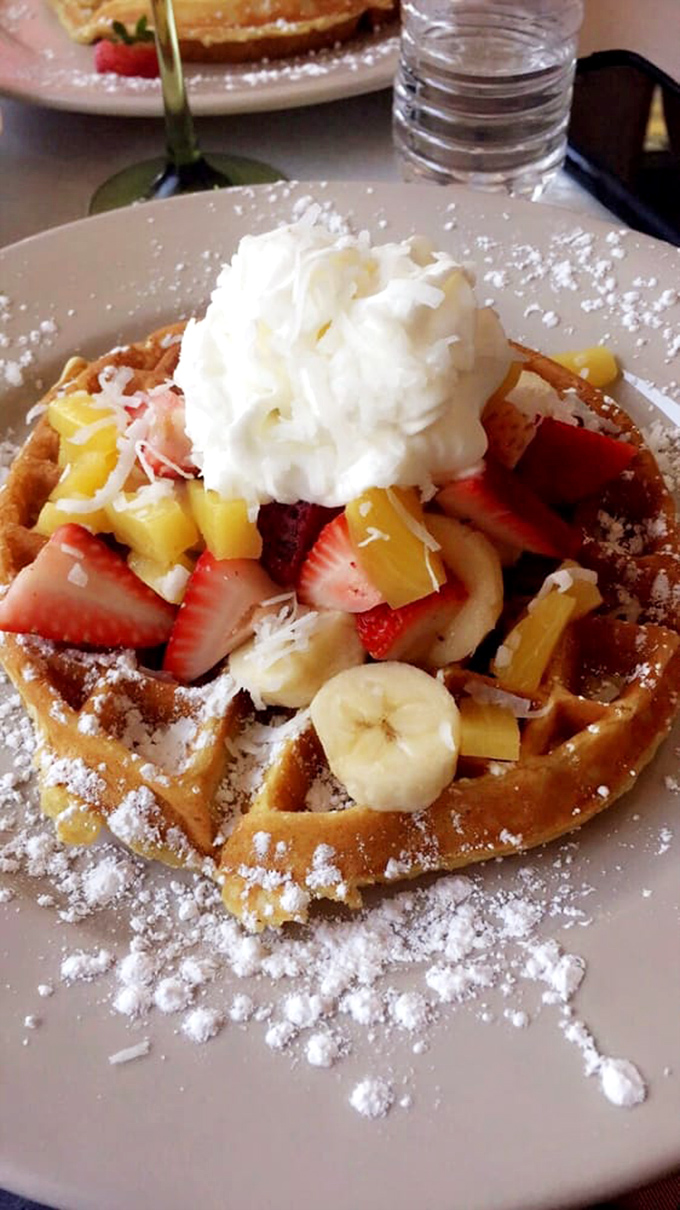 Waffle wonderland! This fruity masterpiece is what happens when breakfast decides to dress up for a tropical vacation.