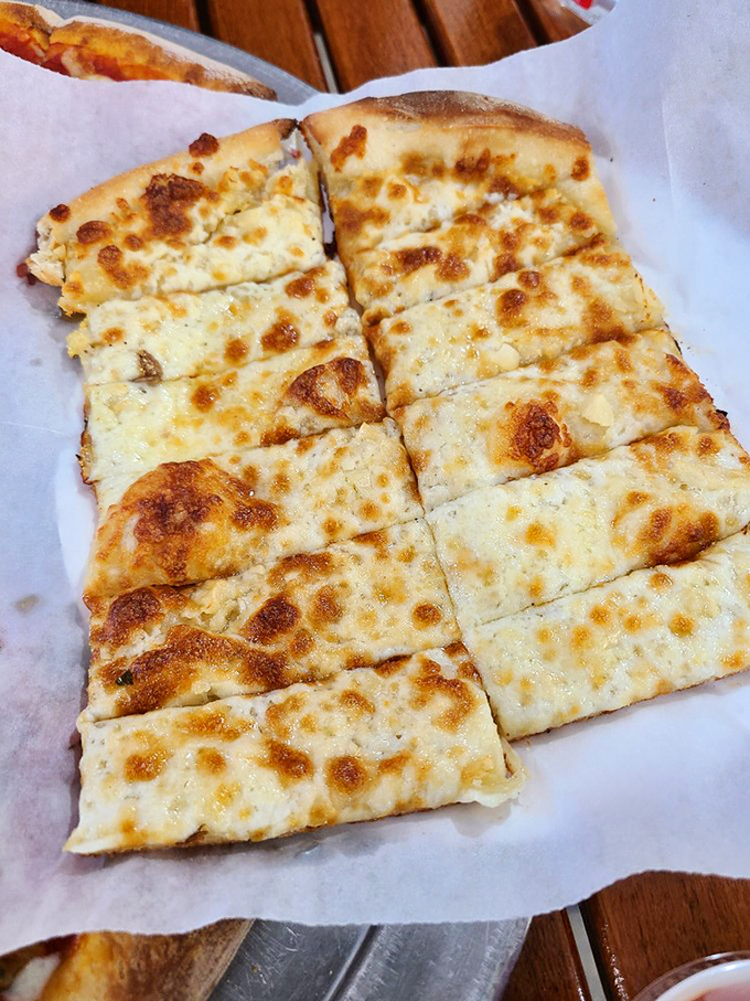 Garlic bread that bites back! This cheesy, garlicky goodness is so addictive, it should come with a warning label.