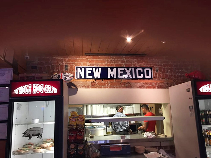 Where the magic happens! Peek into the kitchen and witness the alchemy of smoke, spice, and everything nice that makes Whole Hog Café special.