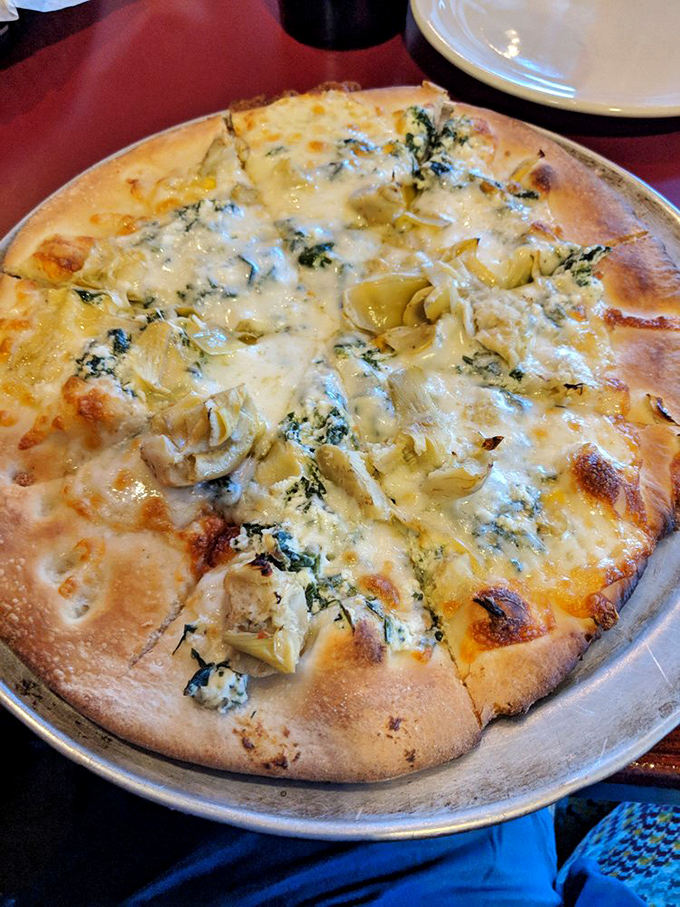 Say cheese! This pizza is so cheesy, it could star in its own rom-com. A perfect supporting actor to the burger main event.