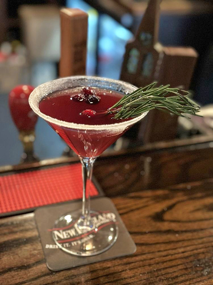 Martini magic in a glass! This ruby-red beauty, garnished with rosemary, isn't just a drink &ndash; it's a conversation starter. Cheers to new adventures!