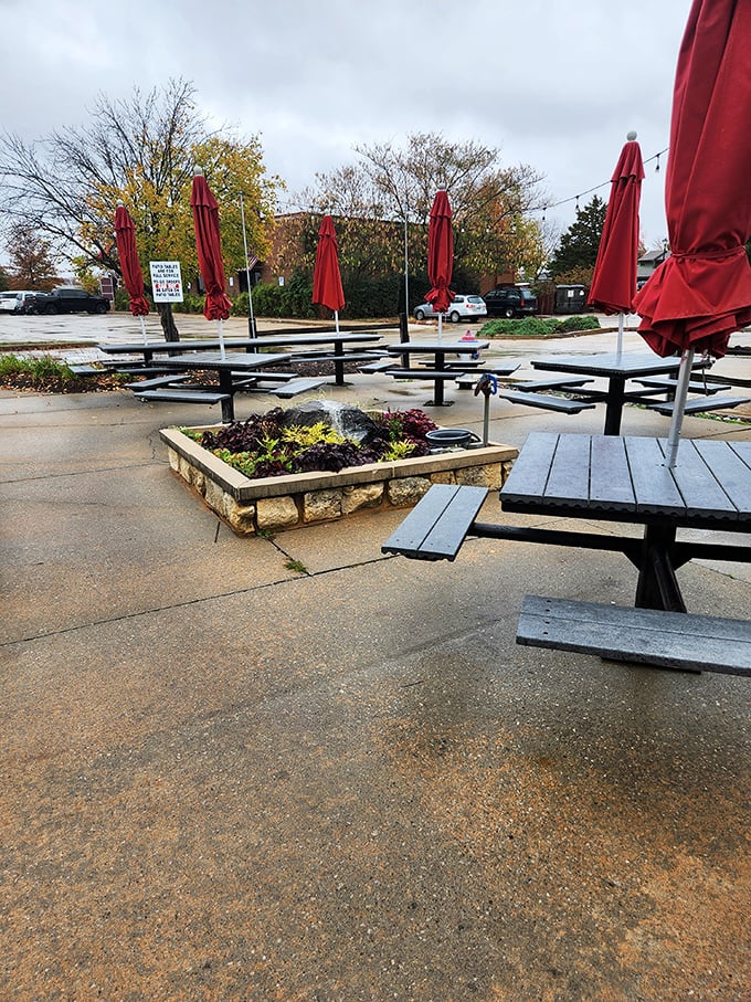 The outdoor seating area offers a breath of fresh air between bites of smoky goodness. Those red umbrellas match the roof &ndash; commitment to branding or happy accident?
