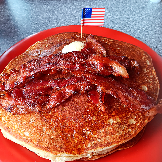 Is that a stack of pancakes or the Leaning Tower of Delicious? With bacon as the cherry on top, this plate is a carb lover's dream come true.
