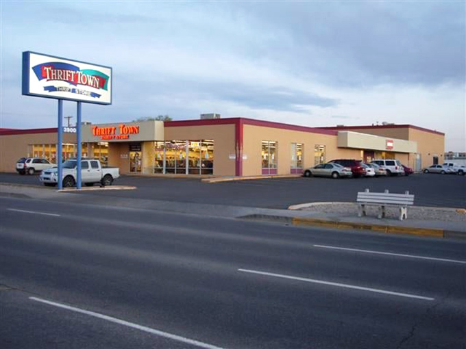 Thrift Town by twilight: where the parking lot transforms into a stage for the great bargain hunt.