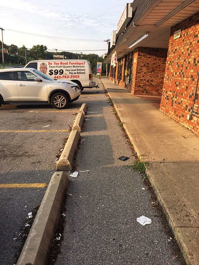 Even the parking lot screams "local charm"! Where else can you grab a donut and a mattress in one stop? Talk about sweet dreams!