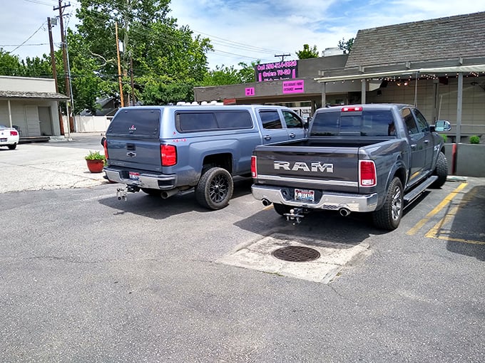 The parking lot where BBQ pilgrimages end and meat-induced happiness begins. Those trucks know where the good stuff is.